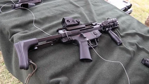 HK MP5 submachine gun lays on the table | Stock Video | Pond5