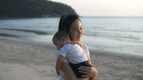 Holiday concept. Mother lulled the baby ... | Stock Video | Pond5