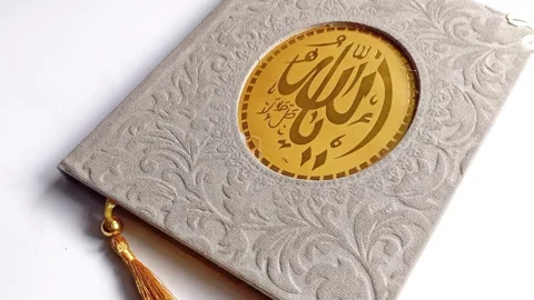 Holy Quran book with yellow gold Allah W... | Stock Video | Pond5