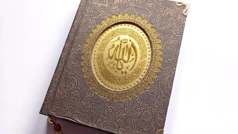 Holy Quran book with yellow gold Allah W... | Stock Video | Pond5