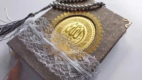 Holy Quran book with yellow gold Allah W... | Stock Video | Pond5