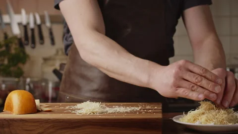 Home Chef Mixing Feta and Gouda Cheese | Stock Video | Pond5