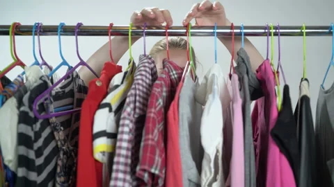 Home closet clothing rack. Teenage girl ... | Stock Video | Pond5
