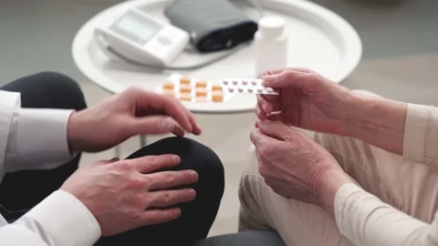 home doctor prescribing medicine to his ... | Stock Video | Pond5