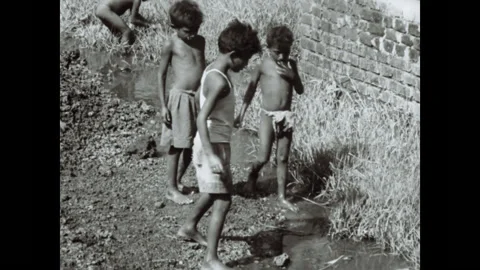 Homeless Children Play With Water On Fie... | Stock Video | Pond5
