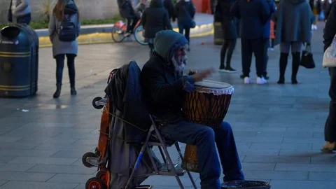 homeless guy raises money as a Street mu... | Stock Video | Pond5