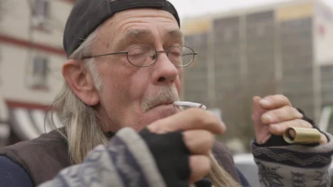 Man Lights Cigarette Stock Footage ~ Royalty Free Stock Videos | Pond5