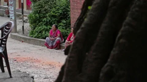 Homeless nepalese woman sitting on the s... | Stock Video | Pond5