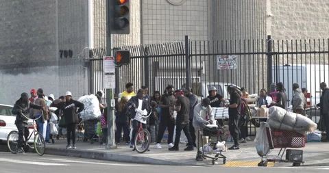 Homeless people line up outside a missio... | Stock Video | Pond5