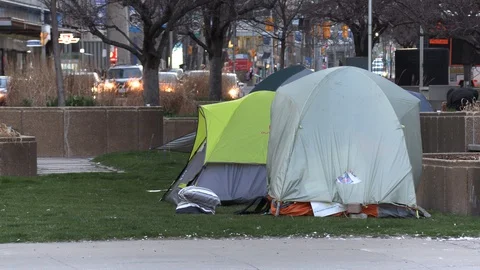 Homeless people sleep in tents on street... | Stock Video | Pond5