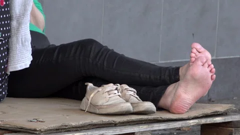 A homeless person’s bare feet stick ou... | Stock Video | Pond5