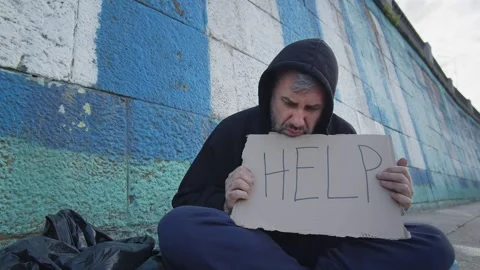 homeless poor young man sitting on the g... | Stock Video | Pond5