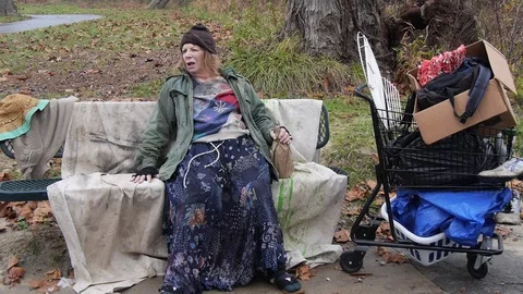 Homeless woman drinking alcohol in brown... | Stock Video | Pond5