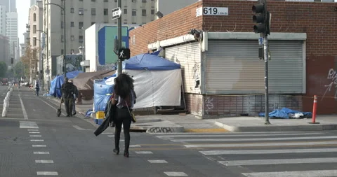 Homeless woman walking alongside tents i... | Stock Video | Pond5