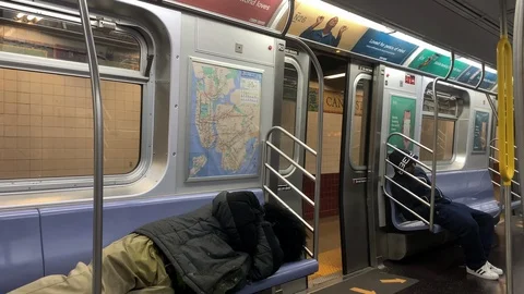 homelessness on NYC subway car interior | Stock Video | Pond5
