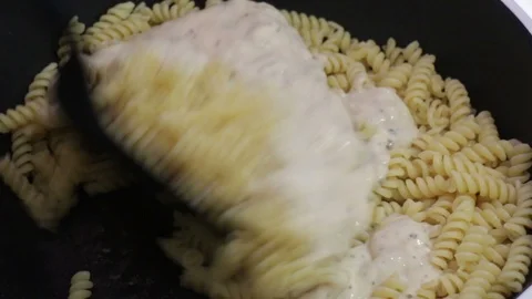 Homemade easy cooking pasta cheese sauce... | Stock Video | Pond5