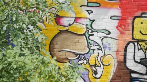 Homer smoking joint graffiti, slow motio... | Stock Video | Pond5