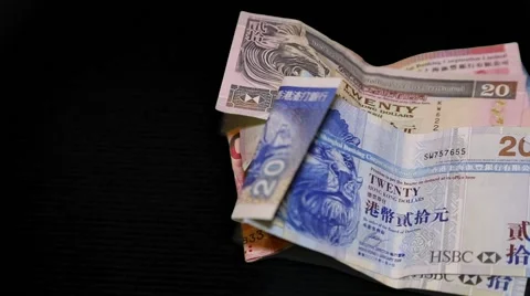 Hong Kong money - pan on black backgroun... | Stock Video | Pond5