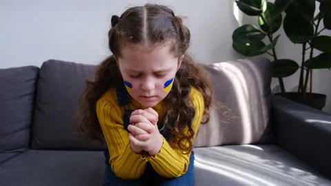 Hopeful little girl kid keep hands in pr... | Stock Video | Pond5