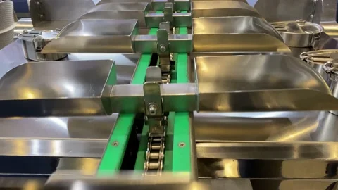 Horizontal bucket conveyor for packaging... | Stock Video | Pond5
