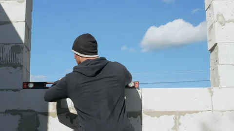 Horizontal gauge in construction. Man bu... | Stock Video | Pond5