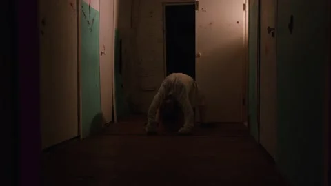 Horror acting - a woman in a straitjacke... | Stock Video | Pond5