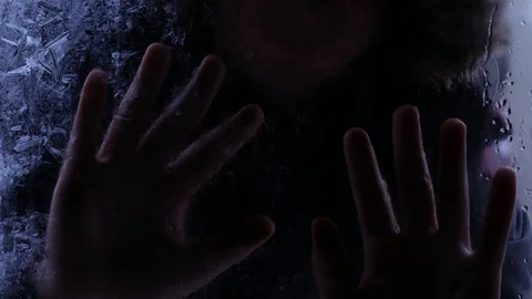 Horror. Scary Man Two Hands On Frozen Wi... | Stock Video | Pond5