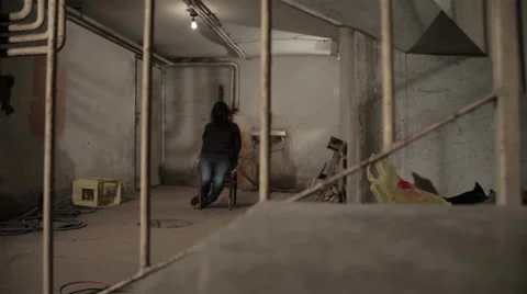 Hostage with bag on head sitting tied. K... | Stock Video | Pond5