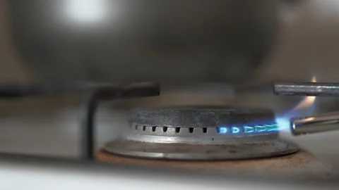 hostess lights an old gas stove for cook... | Stock Video | Pond5
