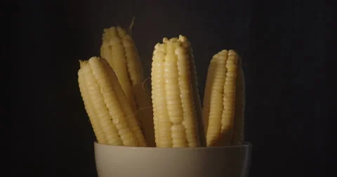 Hot corn cobs on black background. hot c... | Stock Video | Pond5