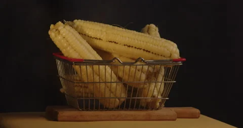 Hot corn cobs on black background. hot c... | Stock Video | Pond5