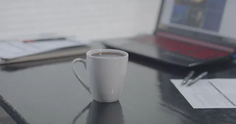 Hot cup of coffee shaking and vibrating ... | Stock Video | Pond5