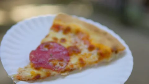 A hot slice of pepperoni pizza being hel... | Stock Video | Pond5