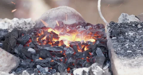 Hot steel in fire flames. Making a knife... | Stock Video | Pond5