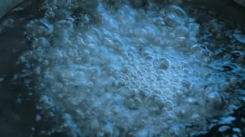 Hot water boiling in the pan.boiling wat... | Stock Video | Pond5