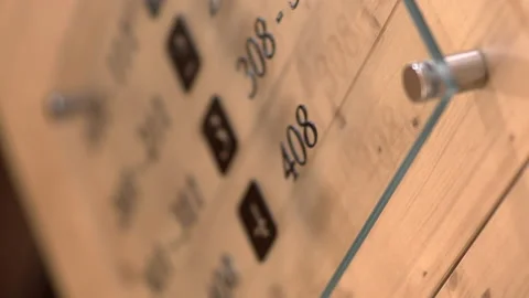 Hotel room numbers direction board on wo... | Stock Video | Pond5