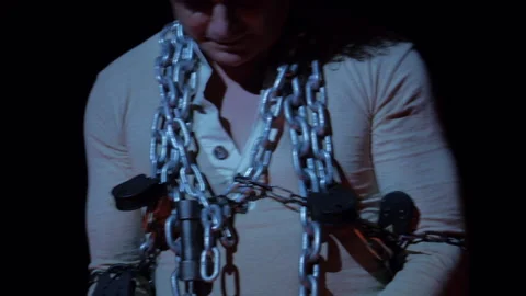 Houdini magic trick, escape artist in ch... | Stock Video | Pond5