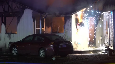 house fire with electric meter arcing an... | Stock Video | Pond5