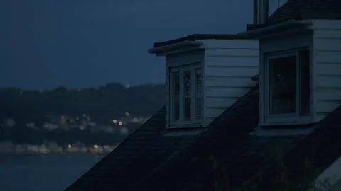 House Roof Windows at Night with City Li... | Stock Video | Pond5