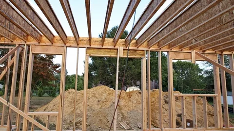 House timber frame for a progressing hou... | Stock Video | Pond5