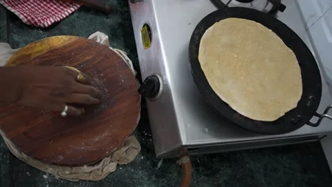 Housewife making chapati, Roti While Coo... | Stock Video | Pond5