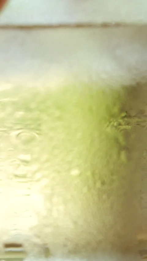 How to mix a cup with cold tea green ice... | Stock Video | Pond5