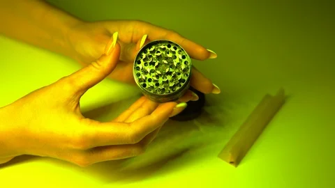 How to roll a joint with marijuana on a ... | Stock Video | Pond5