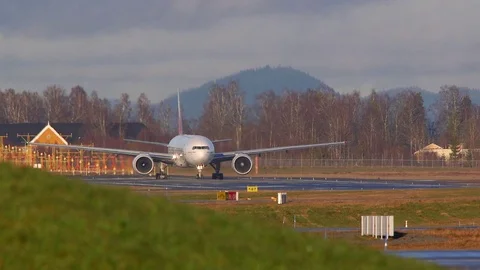 Huge airplane takeoff wet runway condens... | Stock Video | Pond5