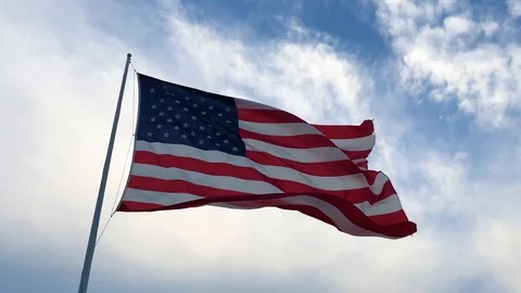 A Huge American Flag waving in the wind ... | Stock Video | Pond5