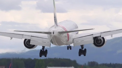huge boeing 777 landing on runway rear v... | Stock Video | Pond5