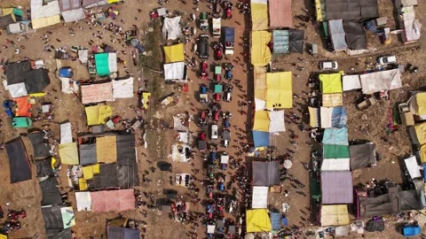 Huge crowd of people and vehicles on a b... | Stock Video | Pond5