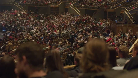 Huge Crowd Sits in Large Packed Auditori... | Stock Video | Pond5