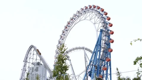A huge ferris wheel inside the amusement... | Stock Video | Pond5