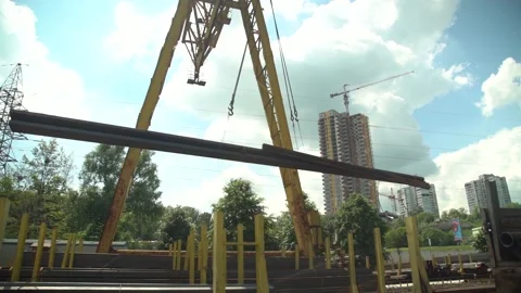 huge gantry crane moves a large metal pi... | Stock Video | Pond5